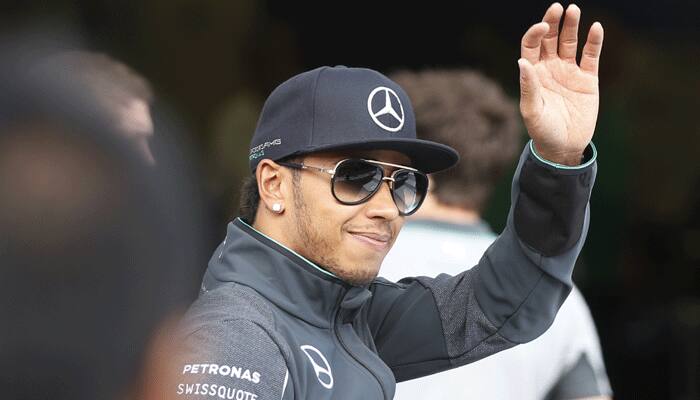 Single-minded Lewis Hamilton speeds to gold and glory | Formula One ...