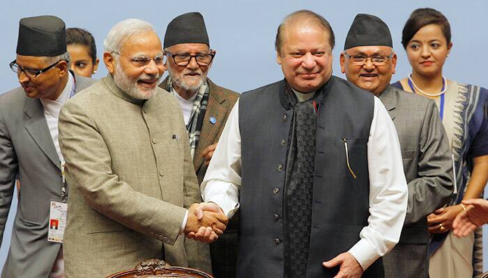 Modi, Sharif shake hands; India says interested in peaceful ties with ...