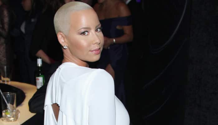 Amber Rose poses in revealing swimsuit | People News | Zee News