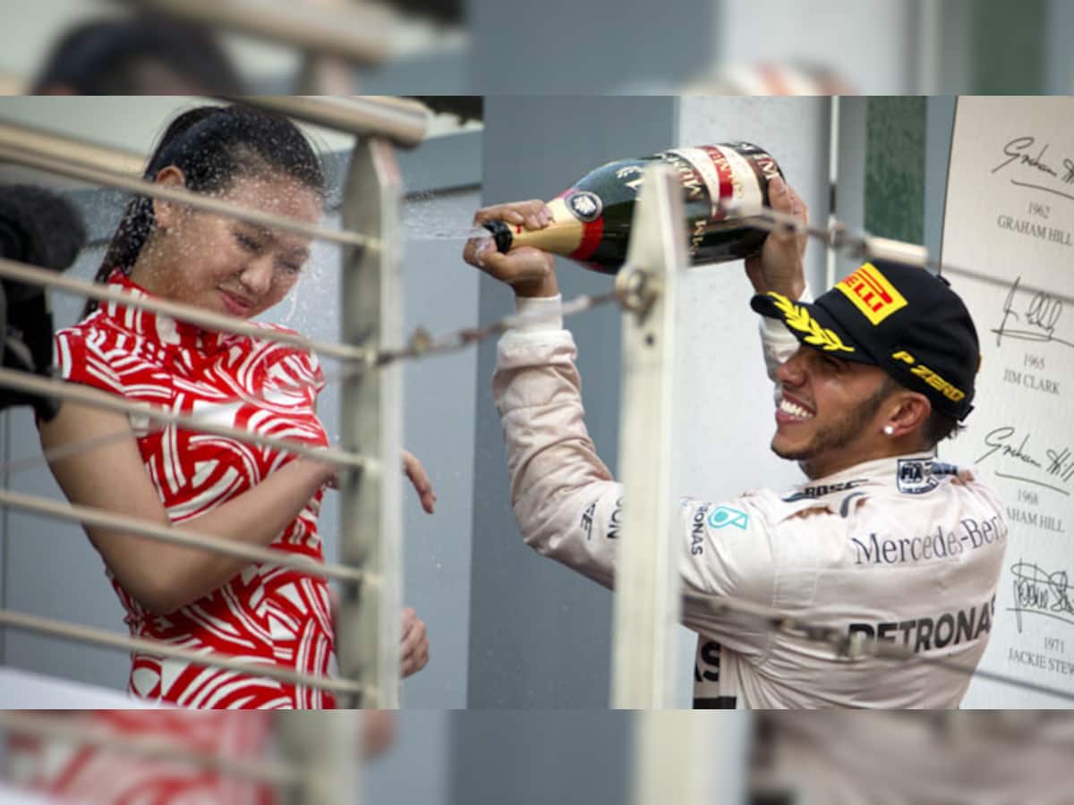 Chinese hostess plays down Lewis Hamilton champagne incident