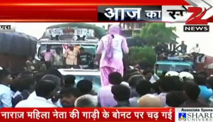 Agra: Woman breaks SP leader's car after his guard winked at her | Zee News