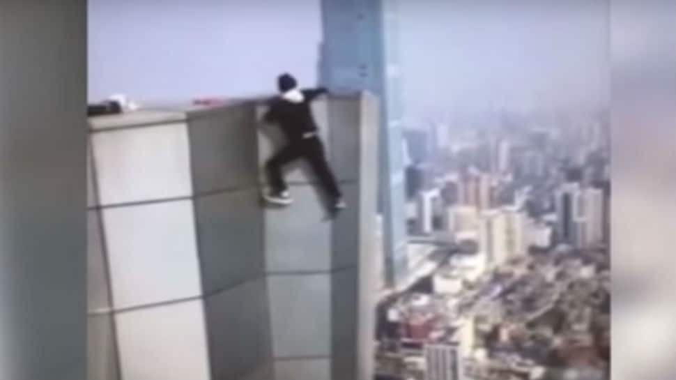 Chinese daredevil falls to death after trying pull ups on top of ...