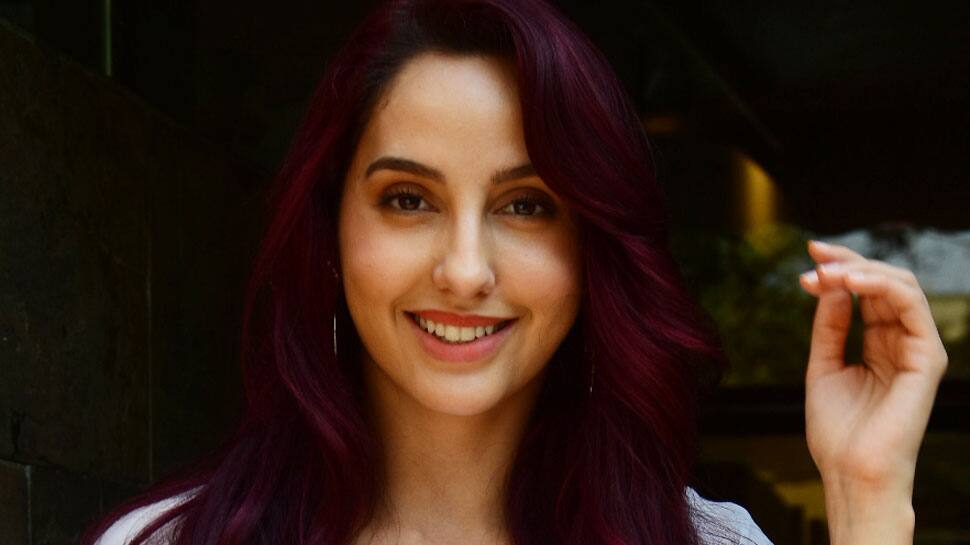 Photo Gallery: Nora Fatehi clicked in Bandra, looks pretty in white ...