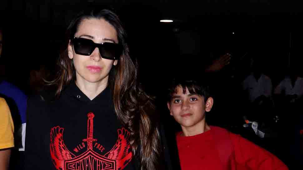 Photo Gallery: Karisma Kapoor arrives back from London with kids ...