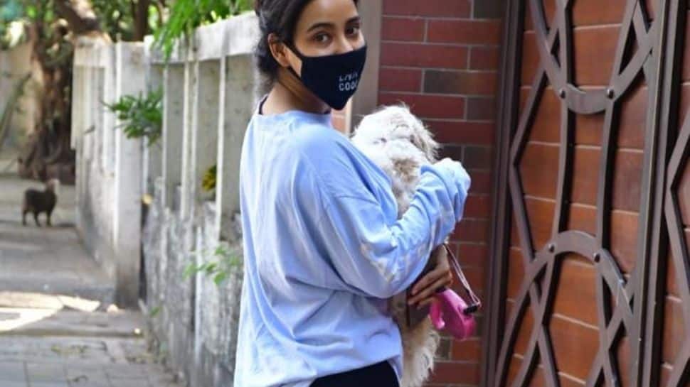 Neha Sharma wears comfy tee and black shorts, takes her pet for walk ...