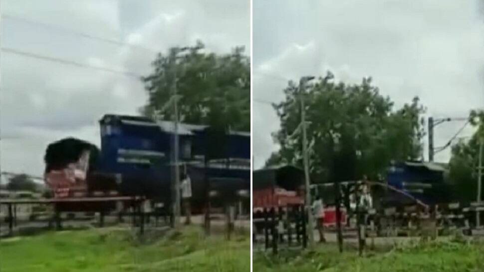 Train colliding with truck captured on camera at a railway crossing in ...
