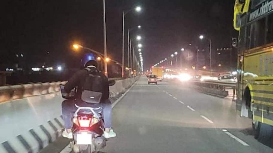 Image of Bengaluru man working on laptop while riding pillion goes ...