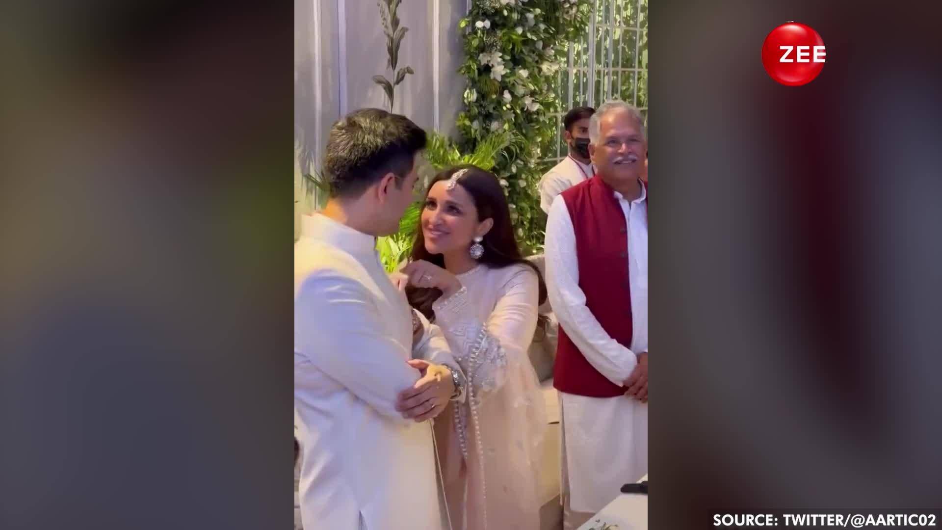 Watch - Raghav Chadha Kisses Parineeti Chopra At Their Engagement As She Sings 'Ve Maahi' | Zee News