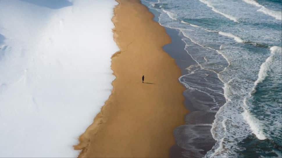 In Pictures - Japans Rare Beach Where Snow, Sand And Sea Come Together