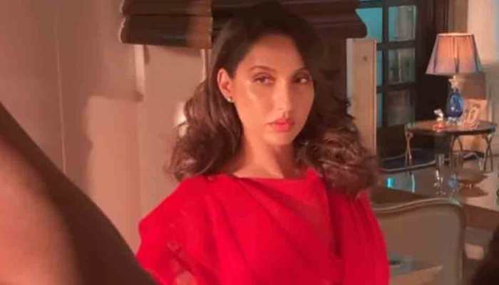 Nora Fatehi strikes killer pose, looks magnificent in a red saree ...
