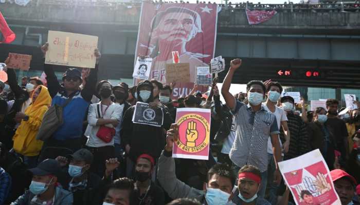 Myanmar military coup: Curfew imposed in 30 cities, protests continue ...