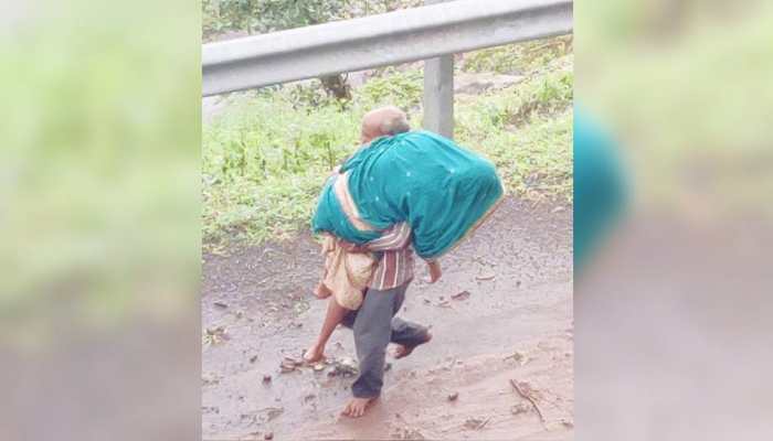 Maharashtra: Man carries ailing wife to hospital as landslide blocks ...
