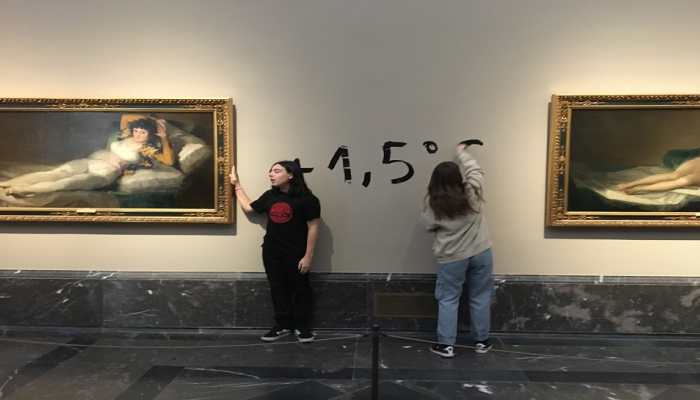 Climate activists glue themselves to famous painting by Spanish artist ...